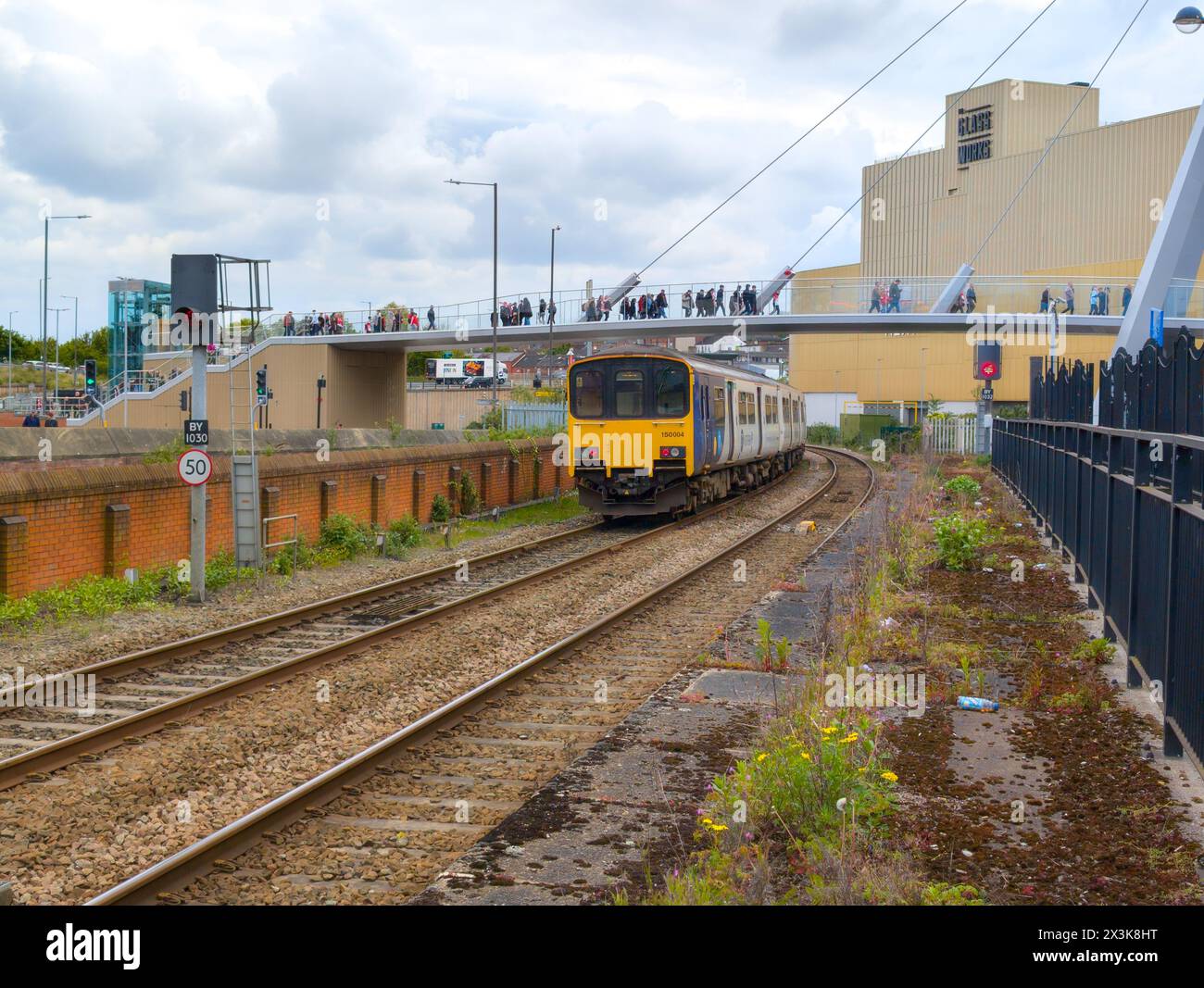 A train leaving Barnsley interchange with the Tommy Taylor Memorial ...