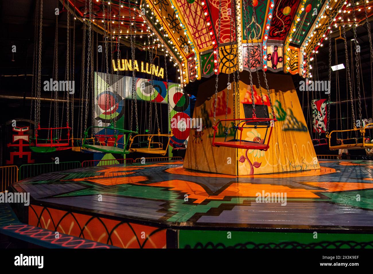 The Luna Luna art amusement park includes a painted swing chair ride ...