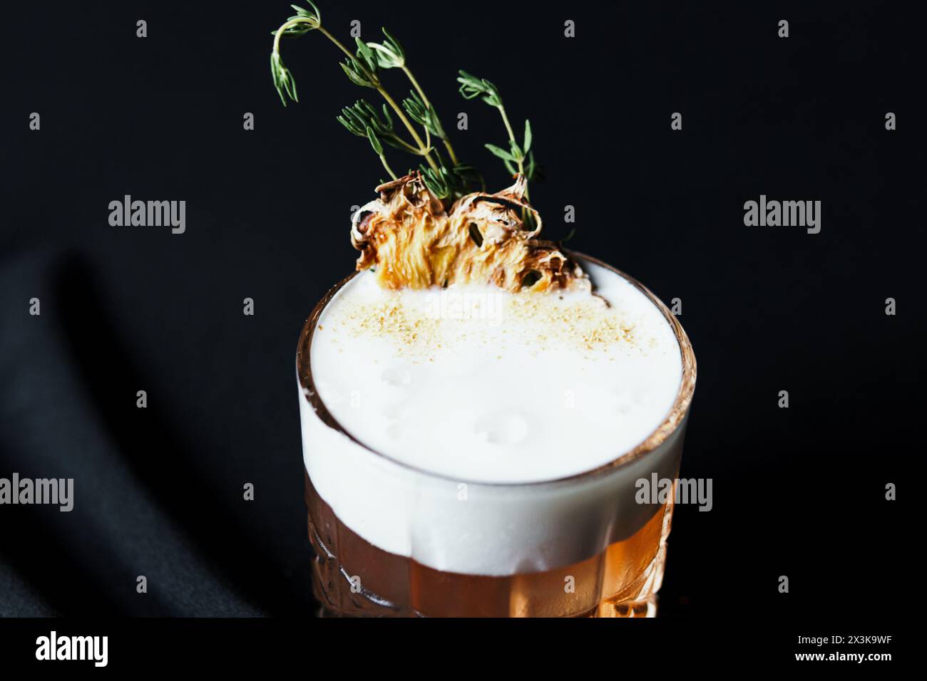 Alcoholic drink. A cocktail with elite alcohol on dark black background ...