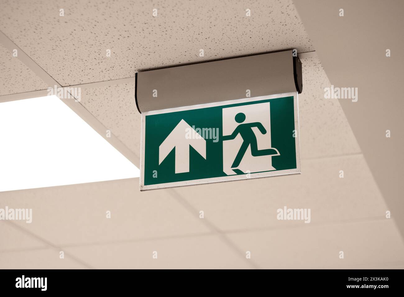 Standard exit sign on a clean light background, on the ceiling Stock ...