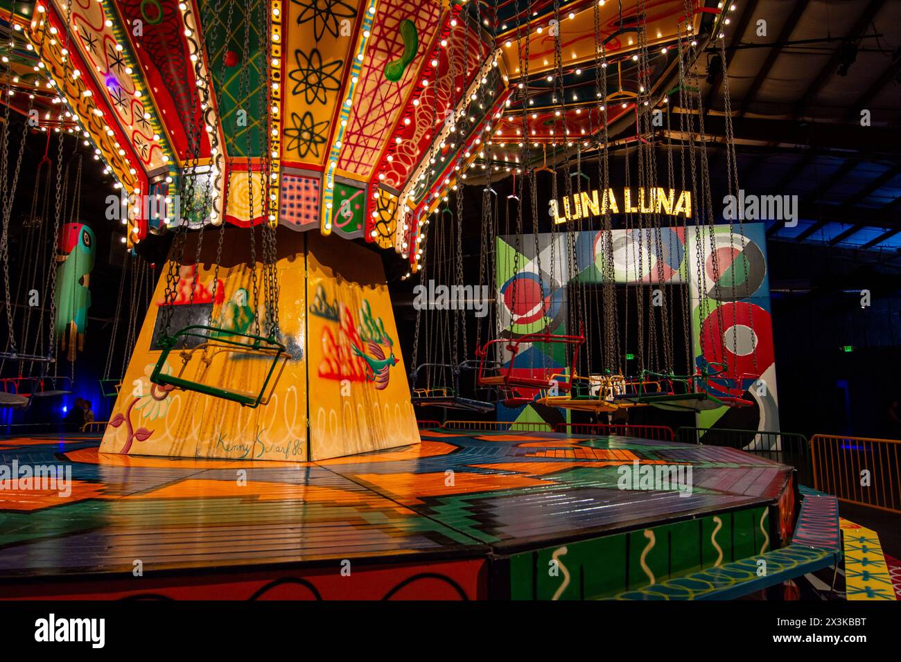 The Luna Luna art amusement park includes a painted swing chair ride ...