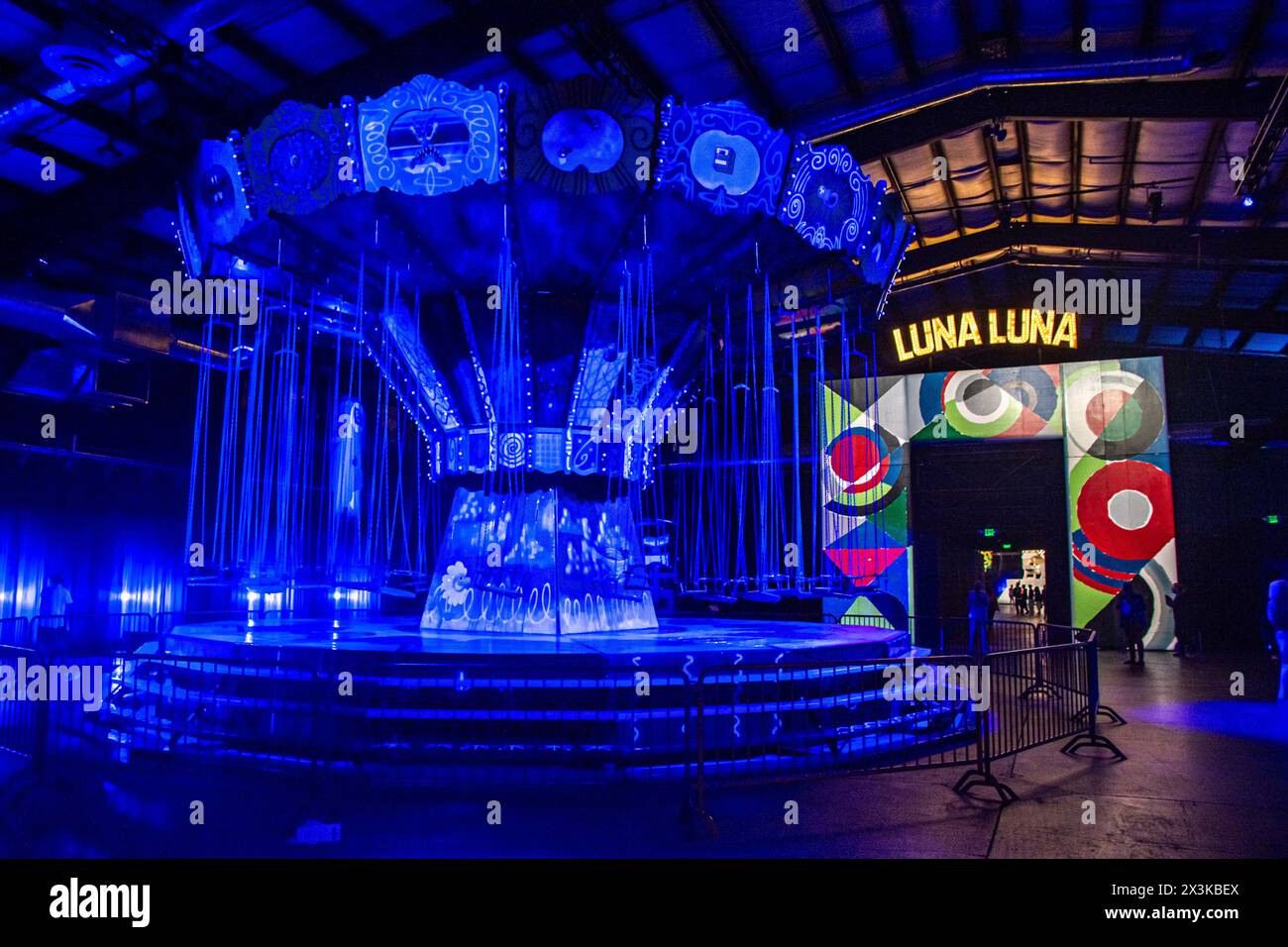 The Luna Luna art amusement park includes a painted swing chair ride by ...