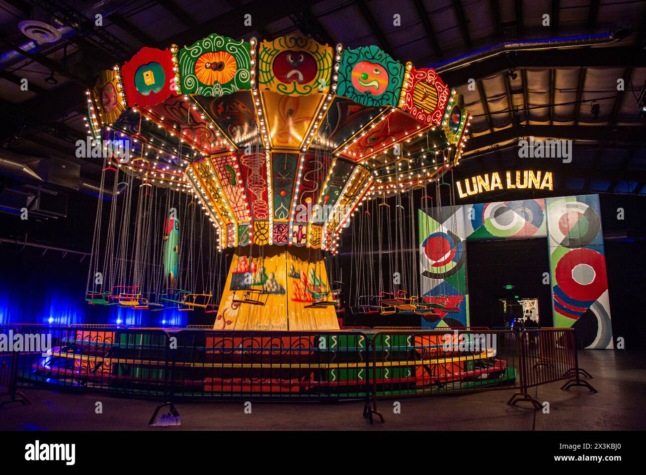 The Luna Luna art amusement park includes a painted swing chair ride by ...