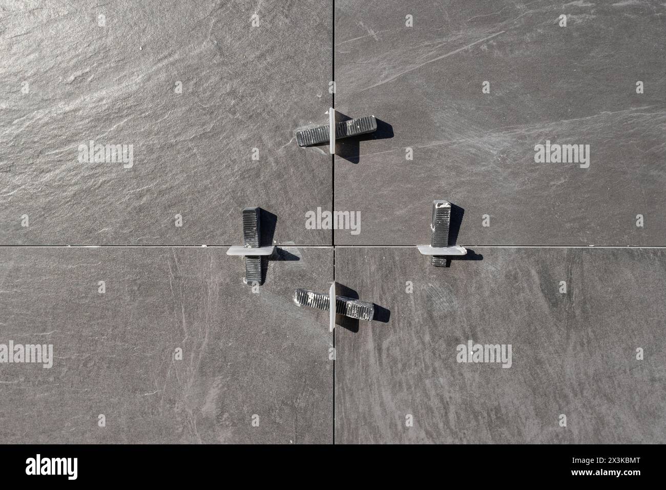 Installed Ceramic tiles with Plastic tile leveling system clips and ...