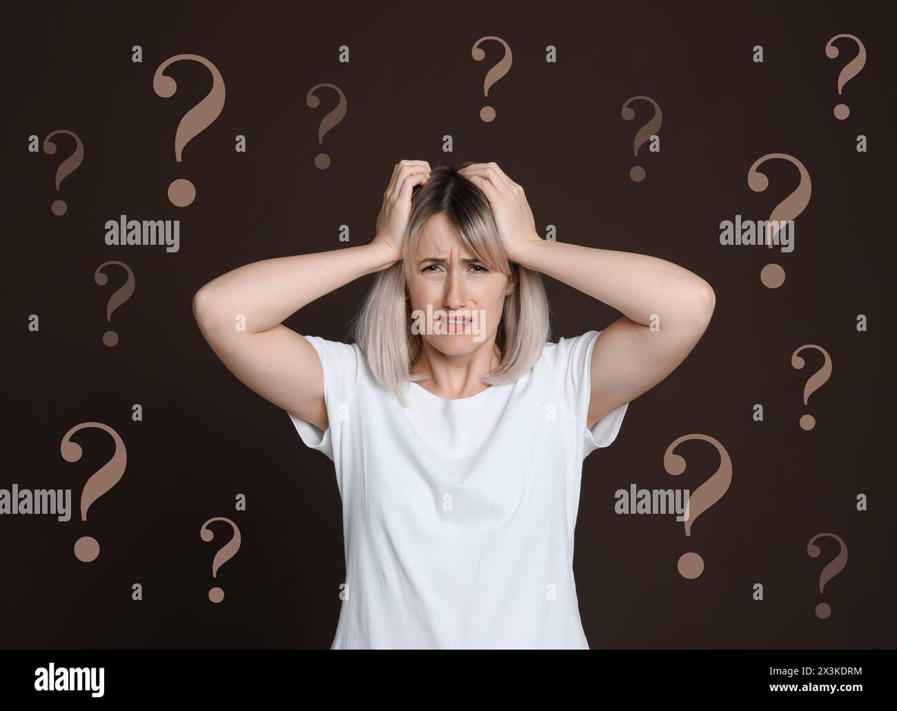 Amnesia. Confused woman and question marks on brown background Stock ...