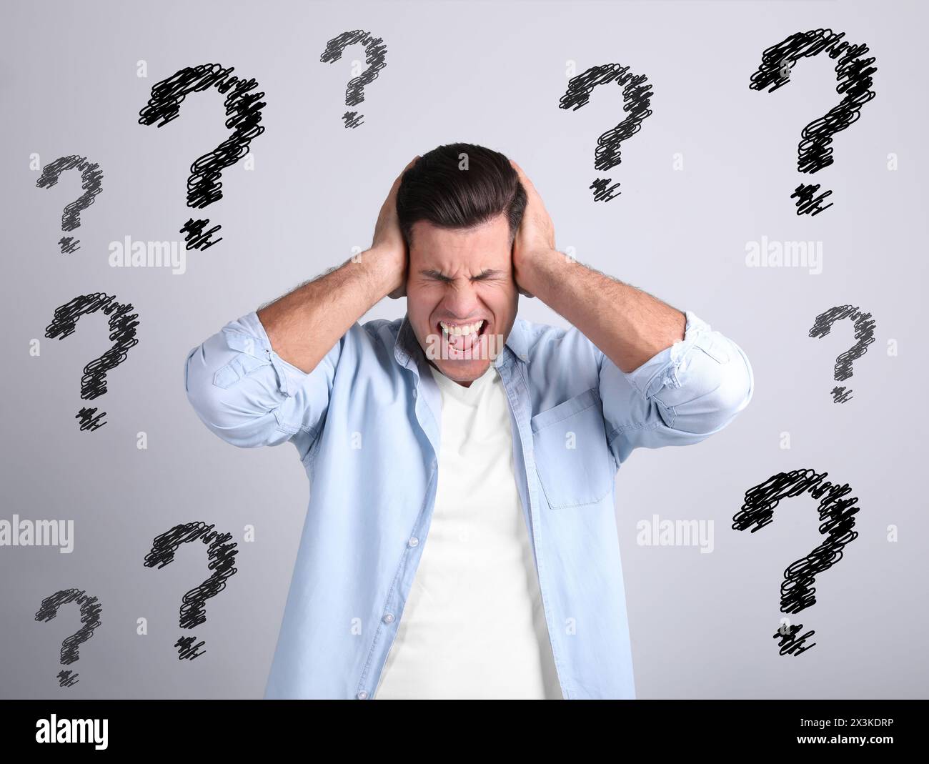 Amnesia. Stressed man and question marks on light background Stock ...