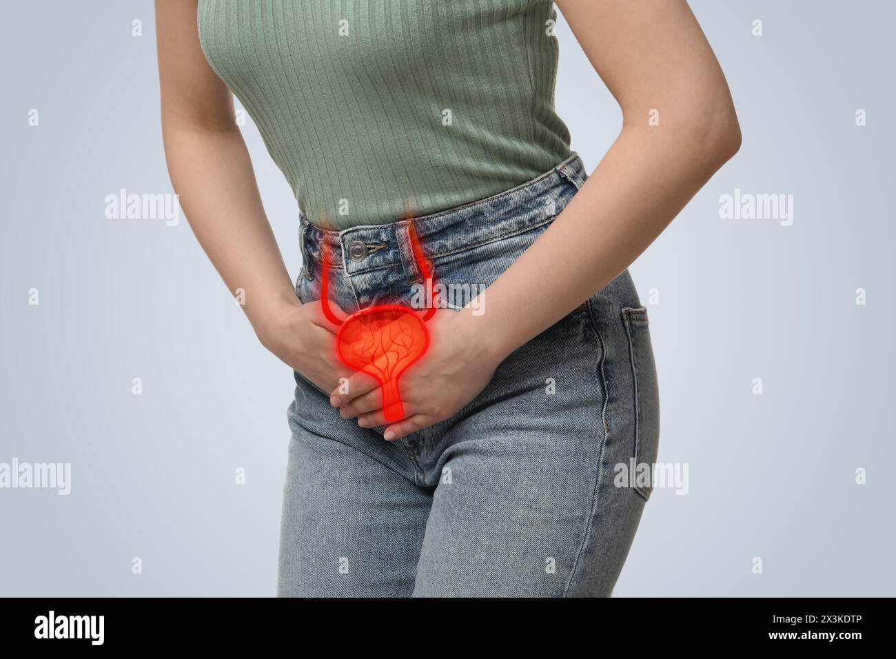 Woman suffering from cystitis on light background, closeup ...