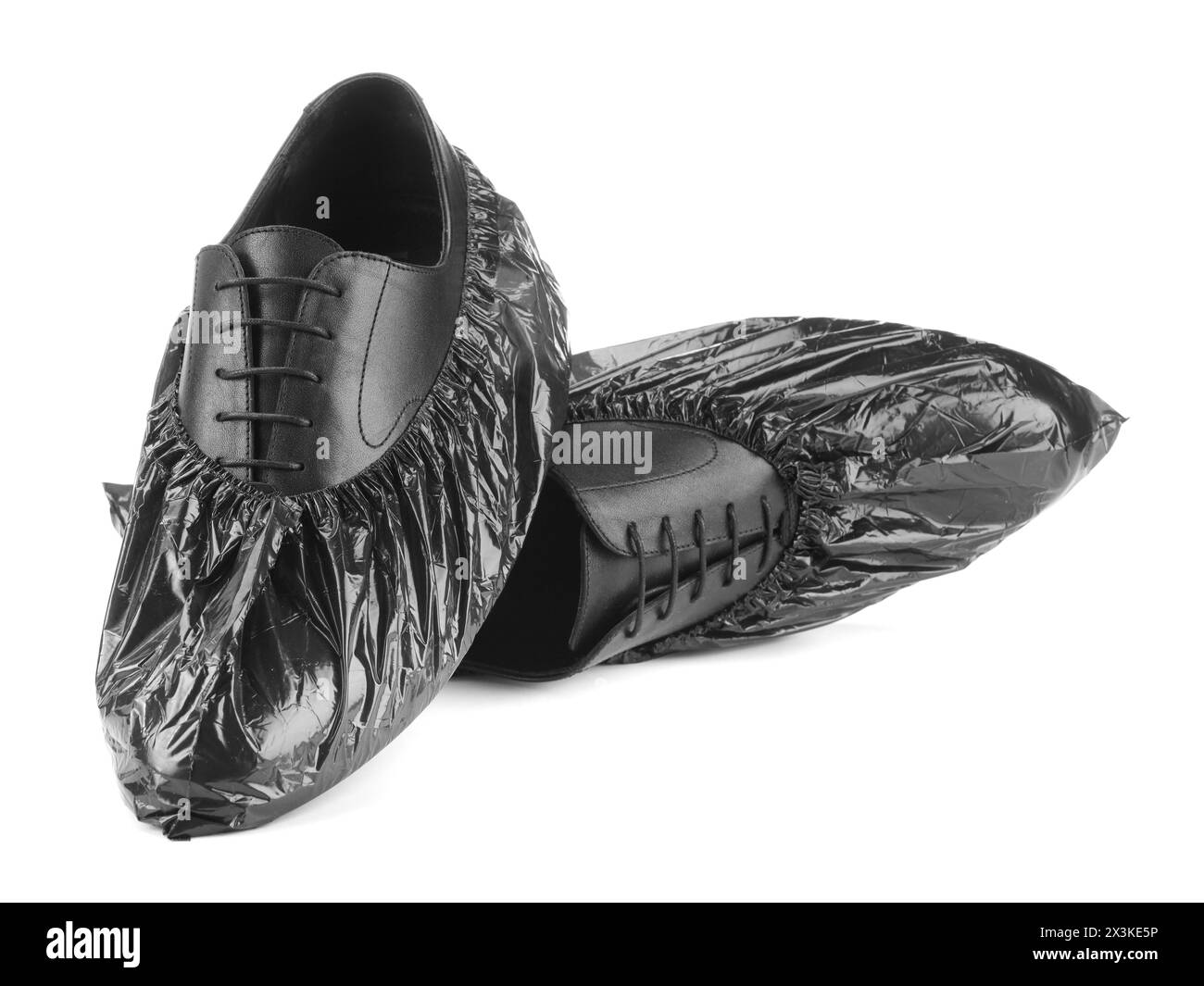 Men's shoes in black shoe covers isolated on white Stock Photo - Alamy