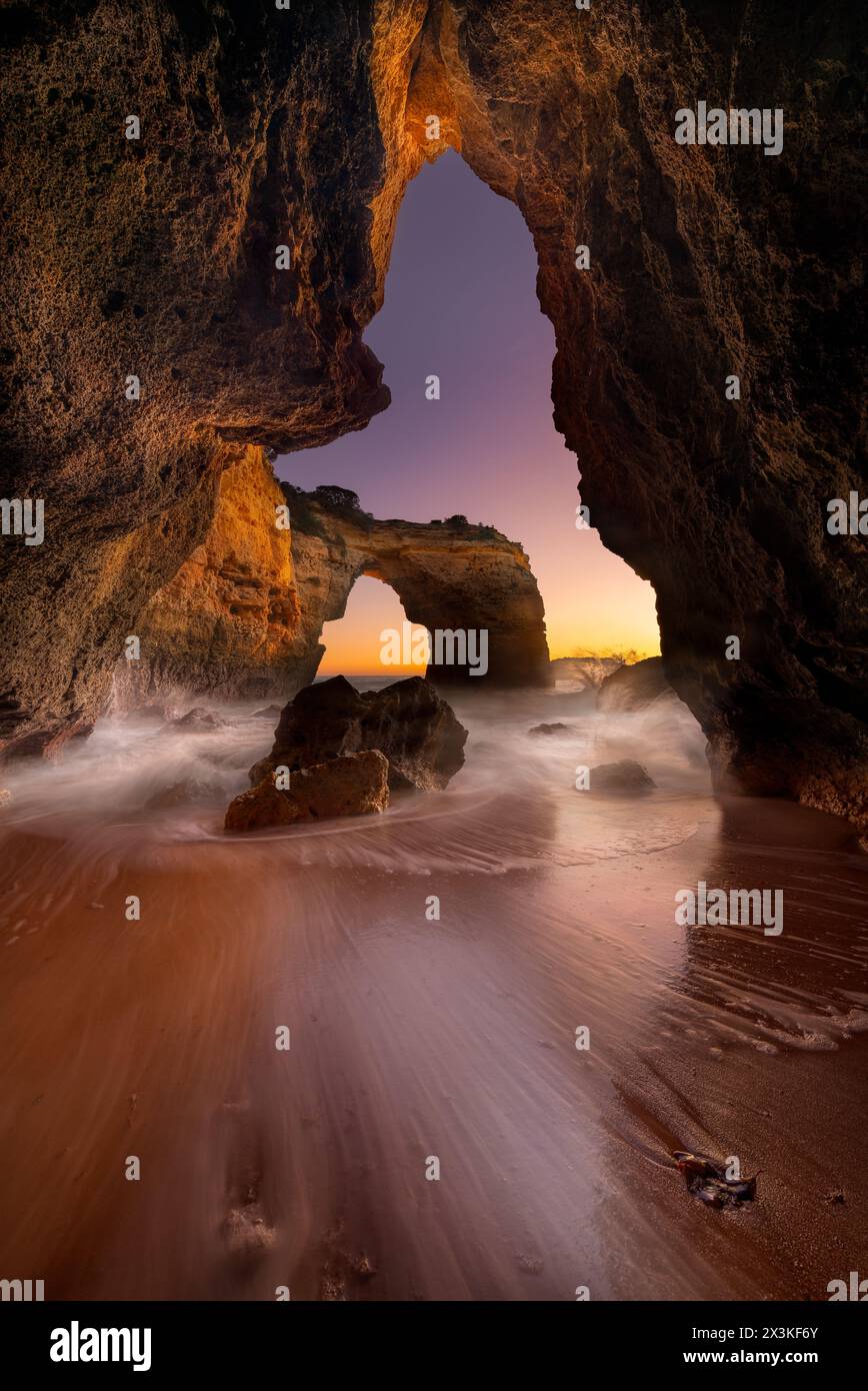 The waves crashing into the cave at Praia de Albandeira with the famous ...