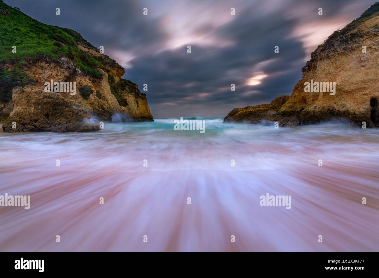 Long exposure of the waves on a beach in Alvor in the Algarve in ...