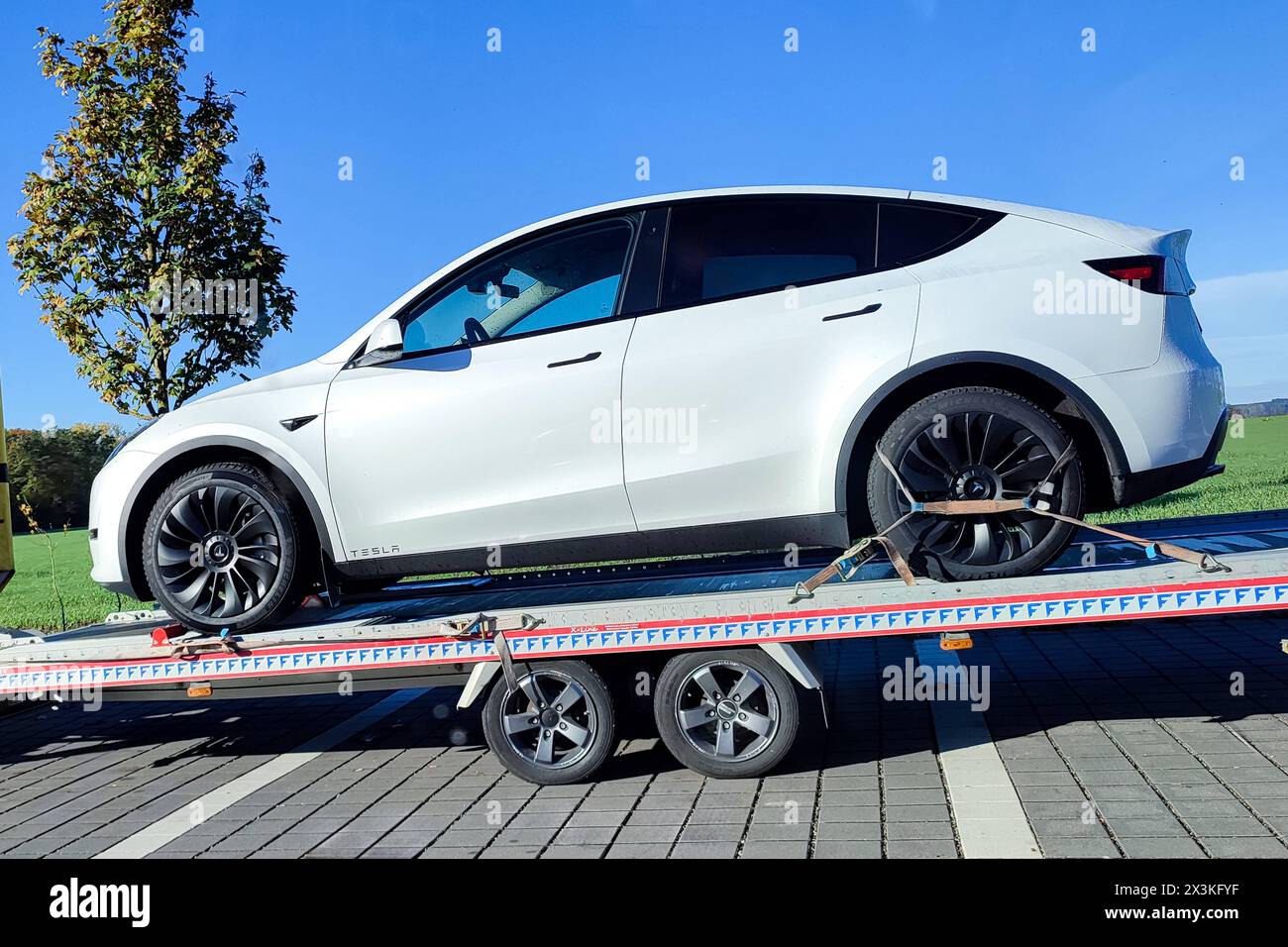April 20, 2024: Tesla Model Y on a car trailer is towed away after a ...