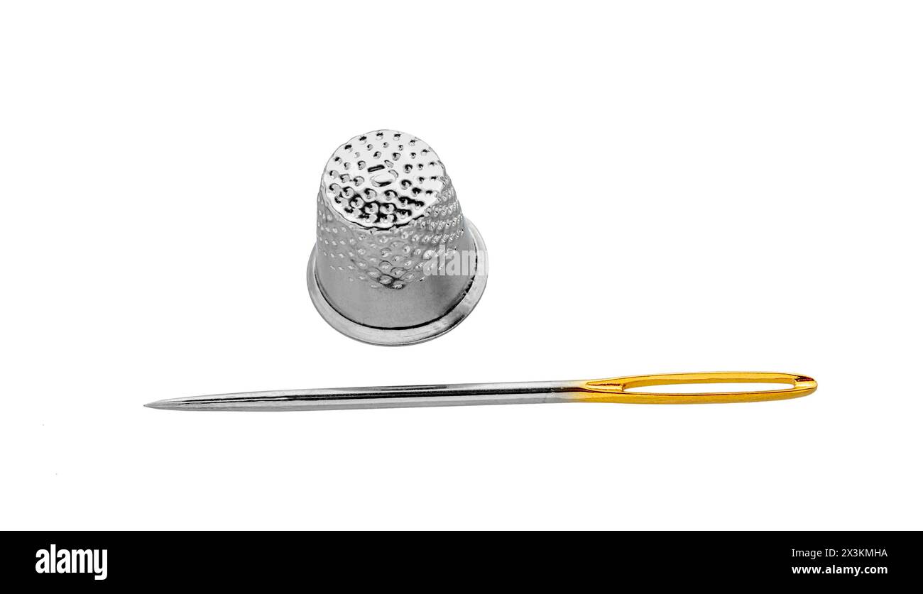 Needle and thimble isolated on a white background. Sewing supplies ...