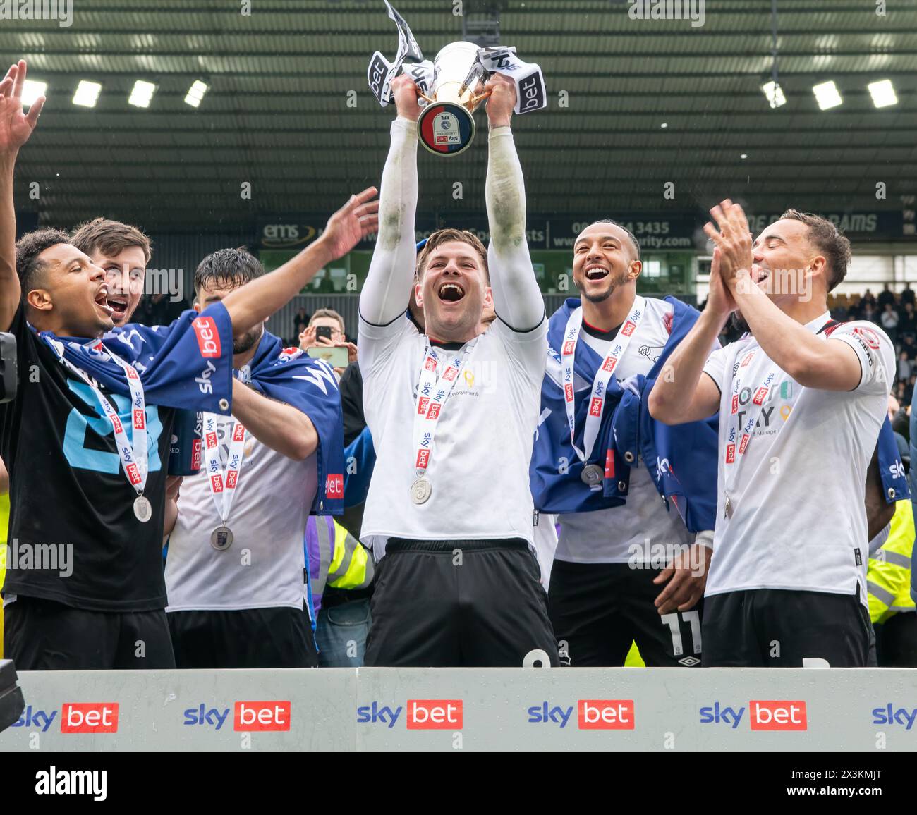 Derby, UK. 27th Apr, 2024. Derby County players celebrate winning the ...