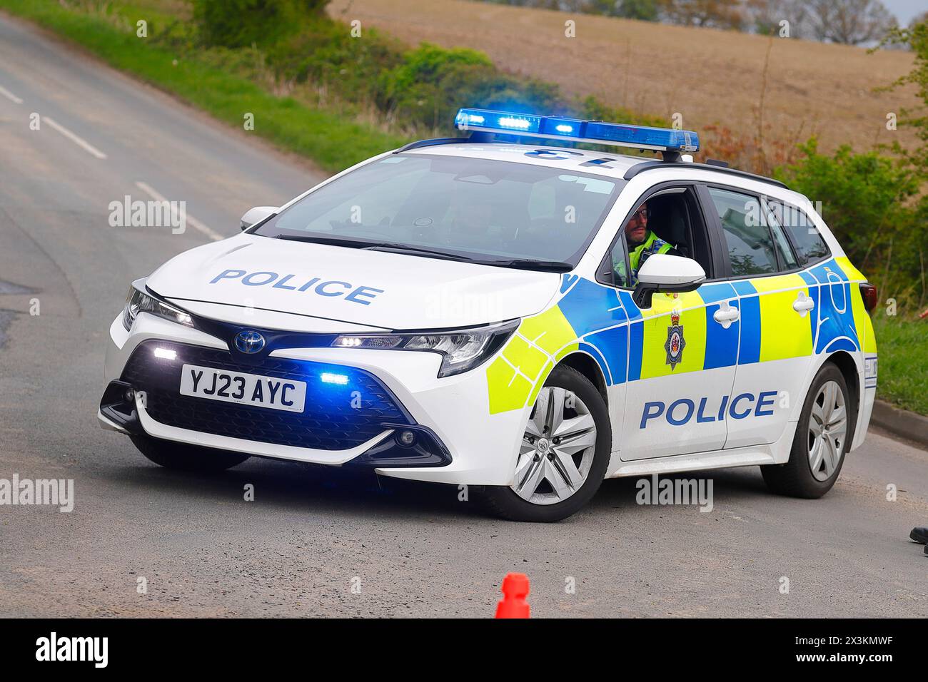A hybrid police vehicle being used as a road block at an incident in ...