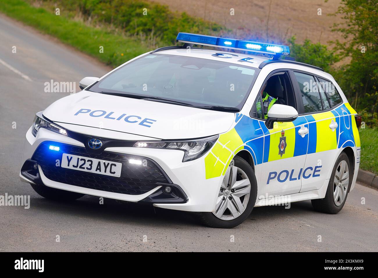 A hybrid police vehicle being used as a road block at an incident in ...