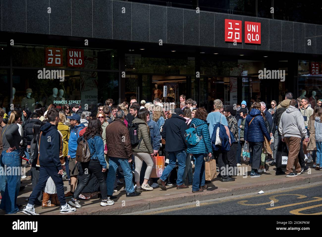 Shoppers walking by Uniqlo on a very crowded Princes Street, Edinburgh ...