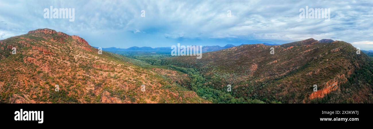 Aerial panorama of Wilpena Pound rock formation at the Gap in sunrise ...