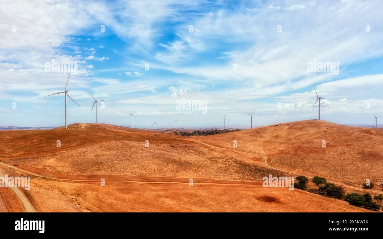 Wide view of windmill turbines on hill tops in remote South Australia ...