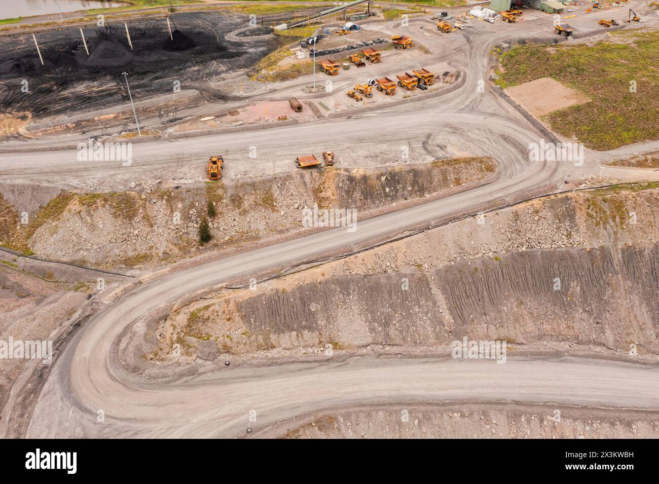 Trucks and earth movers at Ashton open pit coal mine in Hunter valley ...