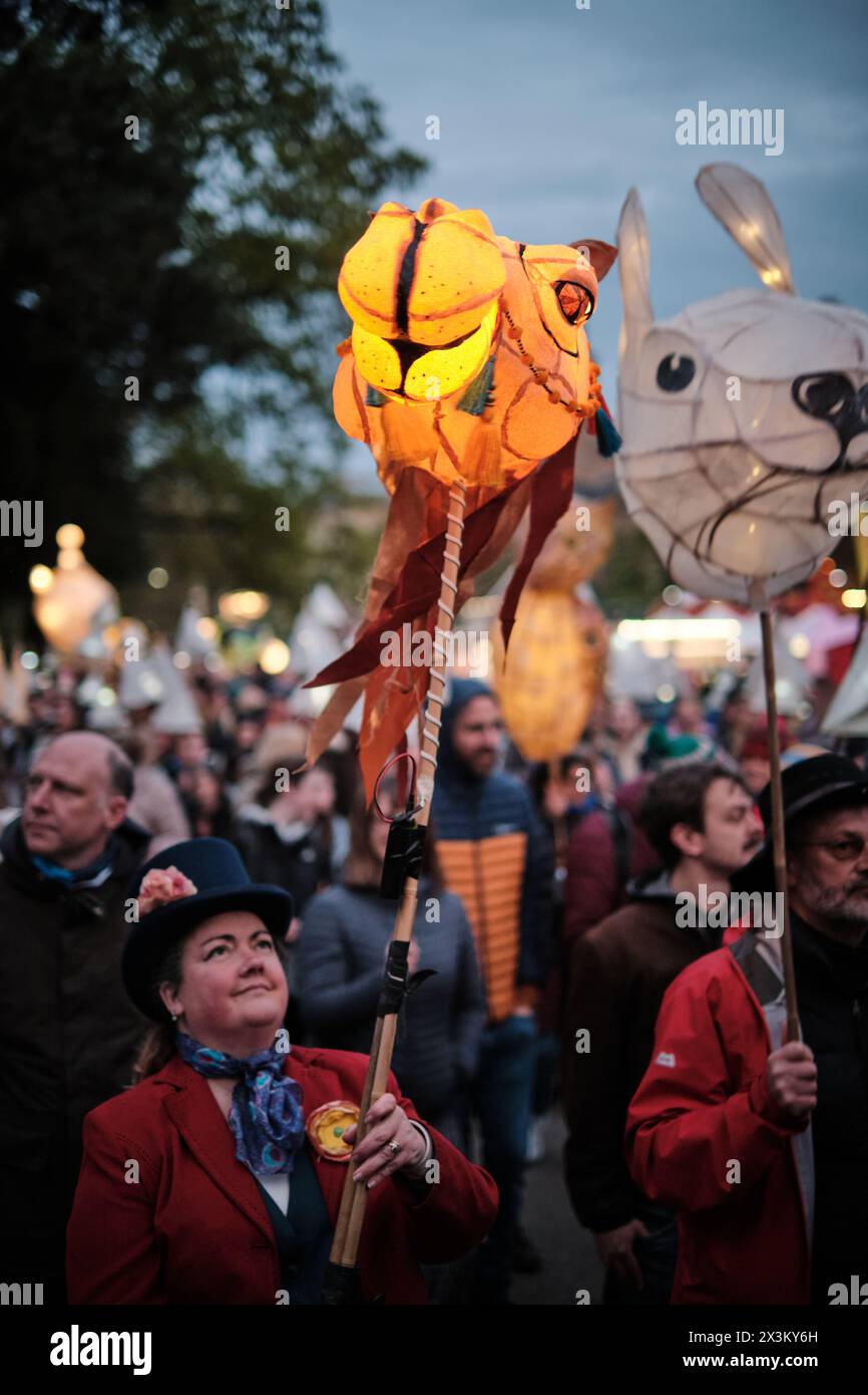 Hand made paper puppet lanterns carried by people in a sundowner parade ...