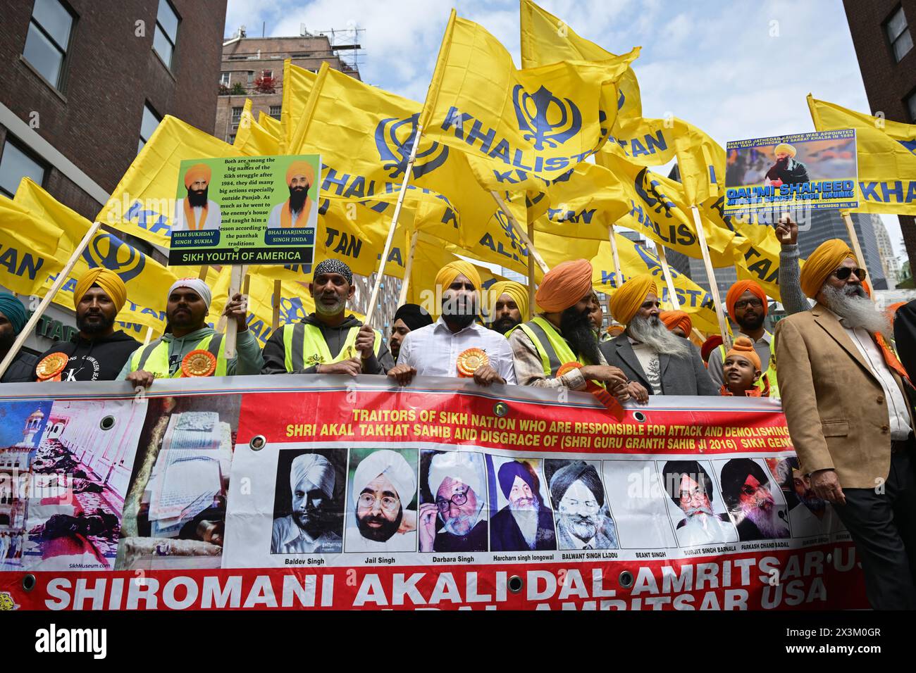 Participants march in the Sikh Cultural Society's Sikh Day Parade on April 27, 2024 in New York ...