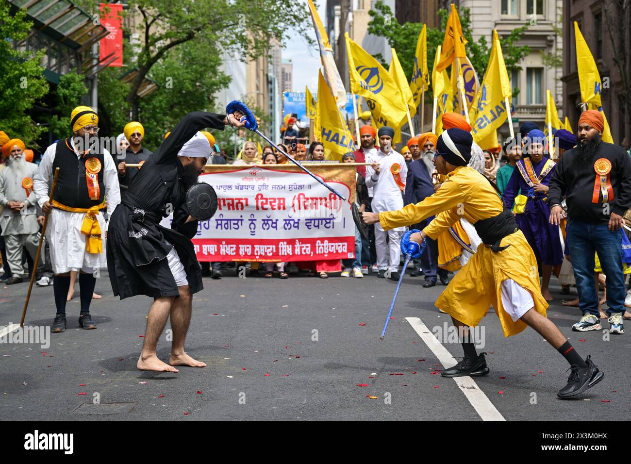Participants march in the Sikh Cultural Society's Sikh Day Parade on April 27, 2024 in New York ...