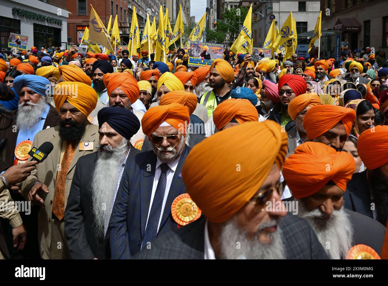 Participants march in the Sikh Cultural Society's Sikh Day Parade on April 27, 2024 in New York ...