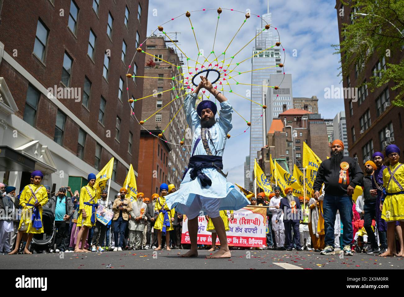 Participants march in the Sikh Cultural Society's Sikh Day Parade on April 27, 2024 in New York ...