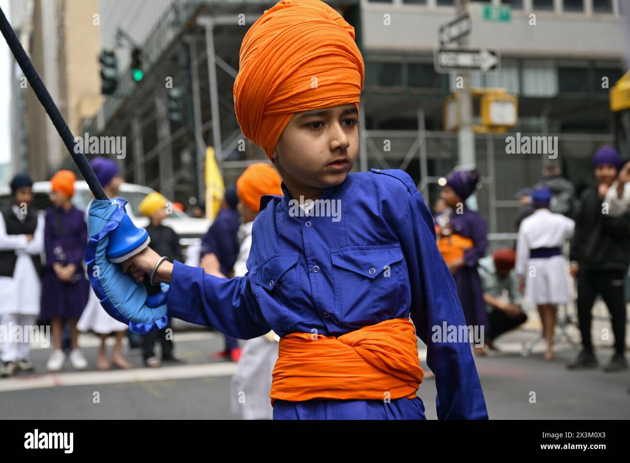 Participants march in the Sikh Cultural Society's Sikh Day Parade on April 27, 2024 in New York ...