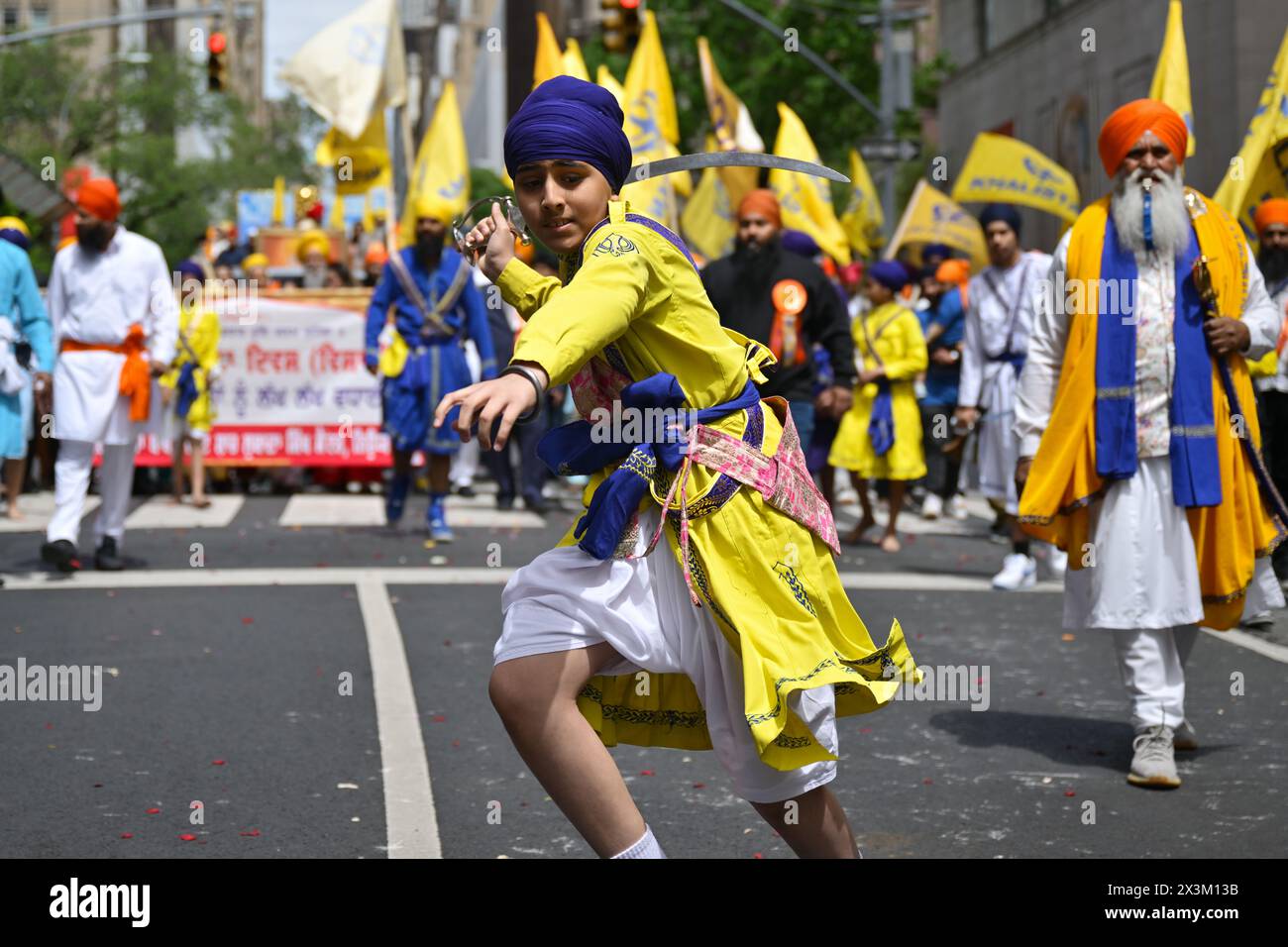 Participants march in the Sikh Cultural Society's Sikh Day Parade on April 27, 2024 in New York ...