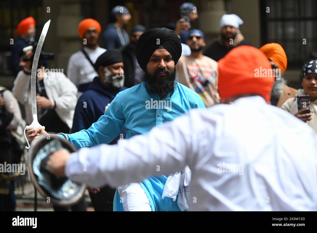 Participants march in the Sikh Cultural Society's Sikh Day Parade on April 27, 2024 in New York ...