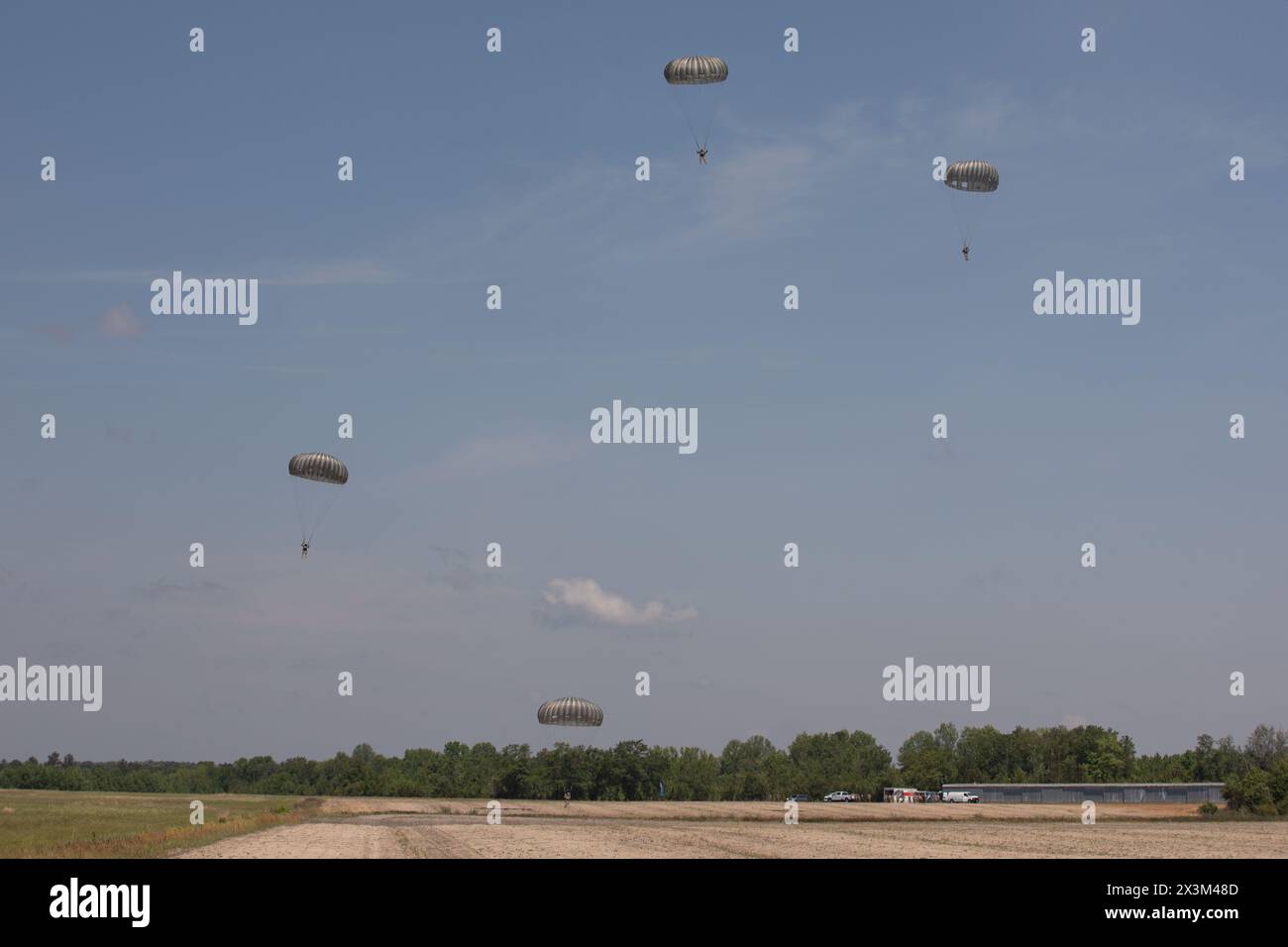 U.S. Army Soldiers float down after conducting static line airborne ...