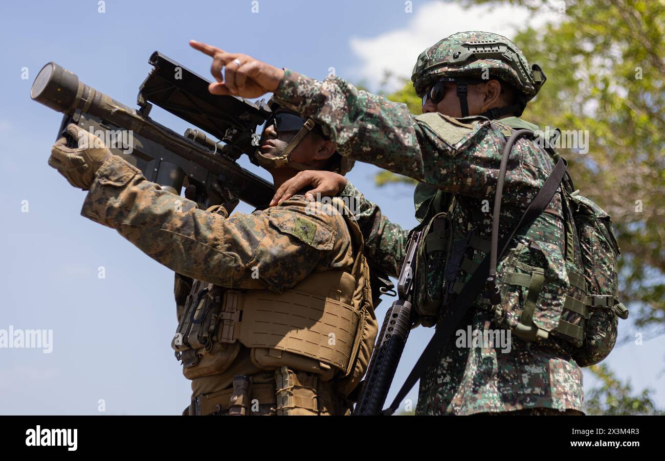 A Philippine Marine with Shore Based Air Defense Battalion observes an ...