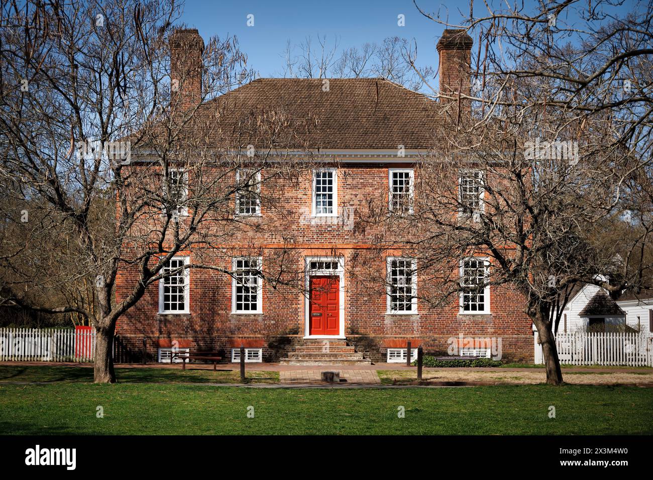 A quiet morning at a beautiful red brick home standing in Colonial ...
