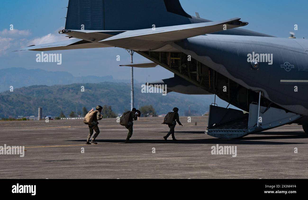 Armed Forces of the Philippines service members board an MC-130J ...