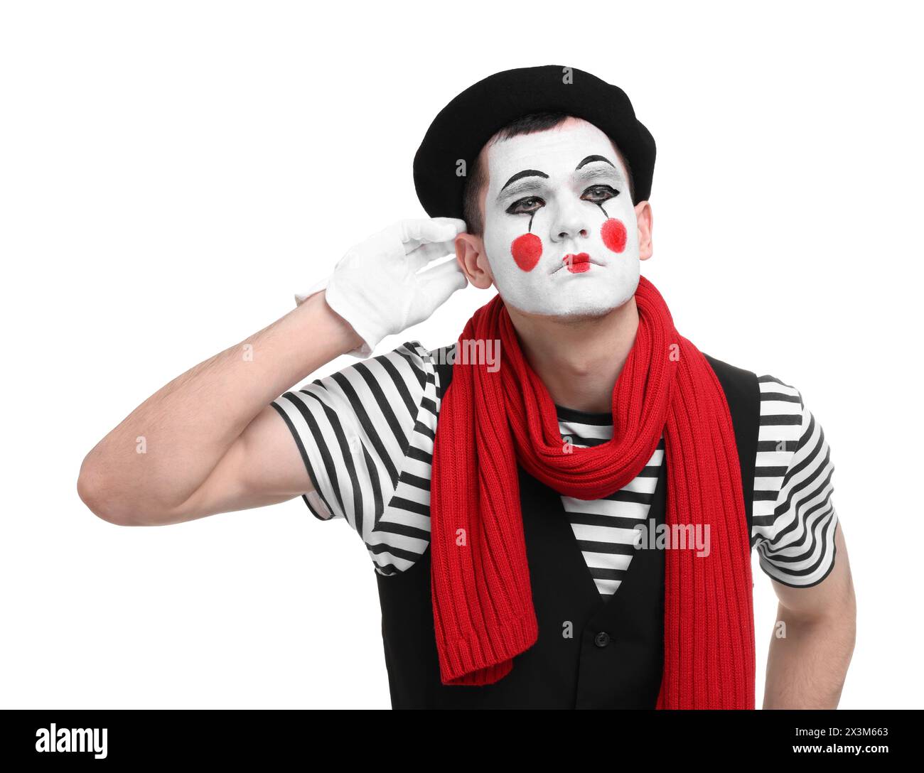 Mime artist showing hand to ear gesture on white background Stock Photo ...