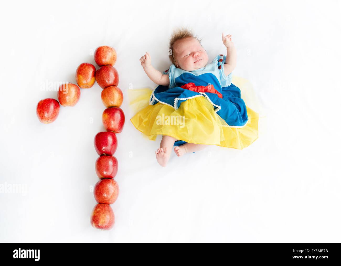 Flat lay picture of a 1 month baby with number made apples. Newborn ...