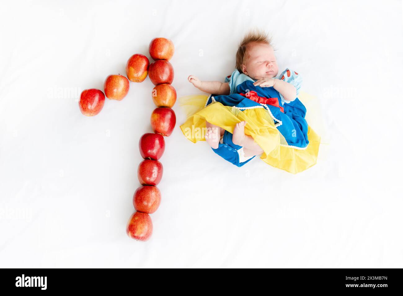 Flat lay picture of a 1 month baby with number made apples. Newborn ...