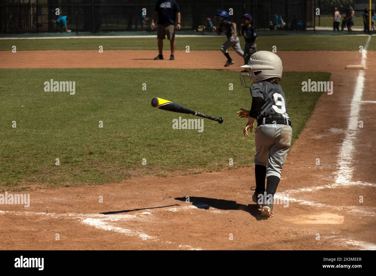 Children with sports equipment playing baseball Stock Photo - Alamy