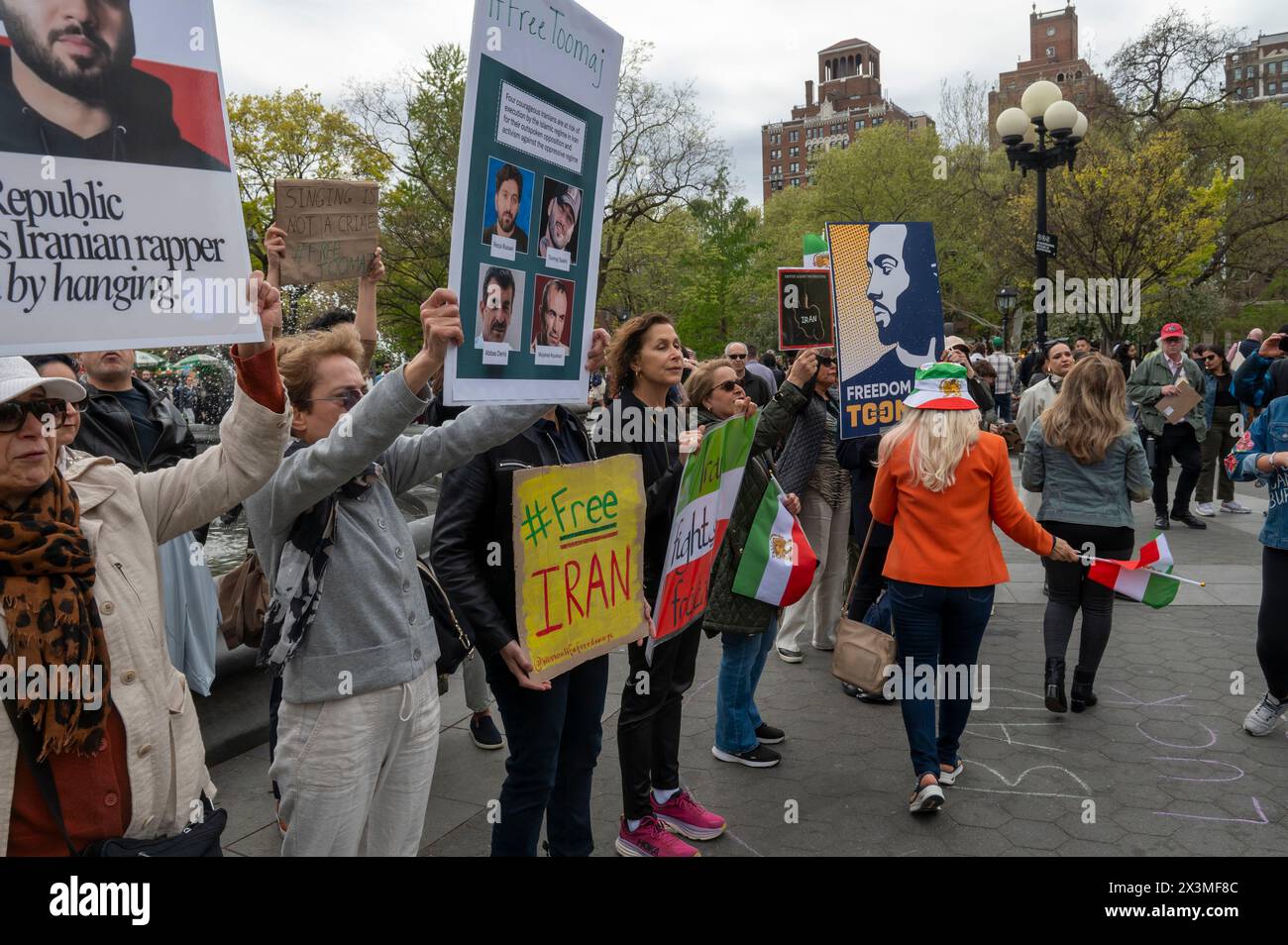 NEW YORK, NEW YORK - APRIL 27: Protesters hold Iranian flags and signs ...