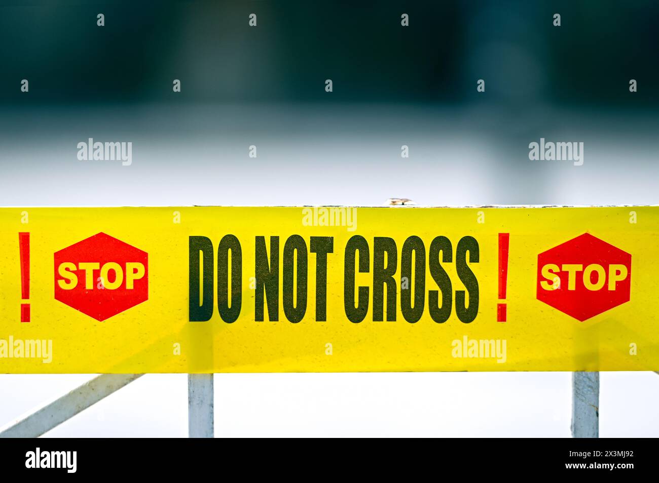 Stop. Do Not cross! Warning yellow tape on fence at crime place Stock ...