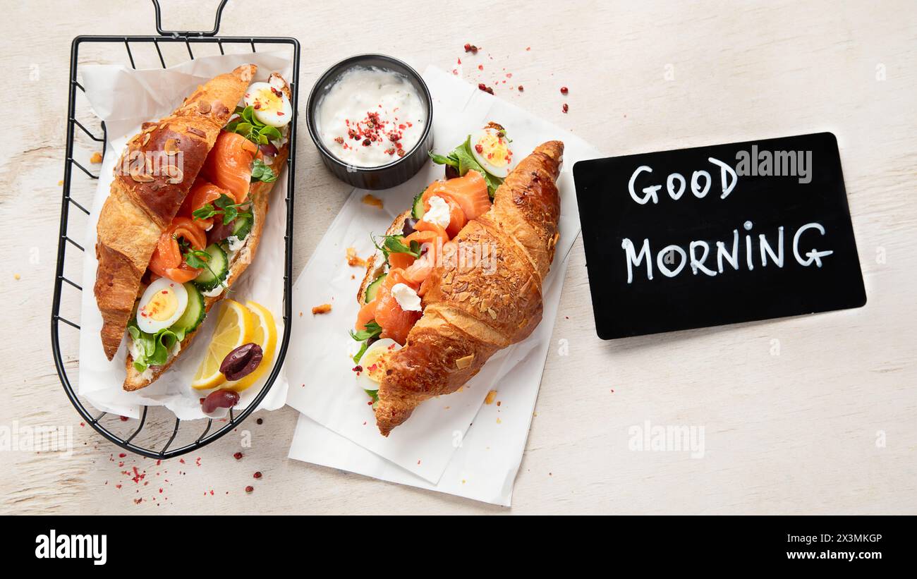 Salted healthy breakfast on light background. Fresh salmon croissant ...