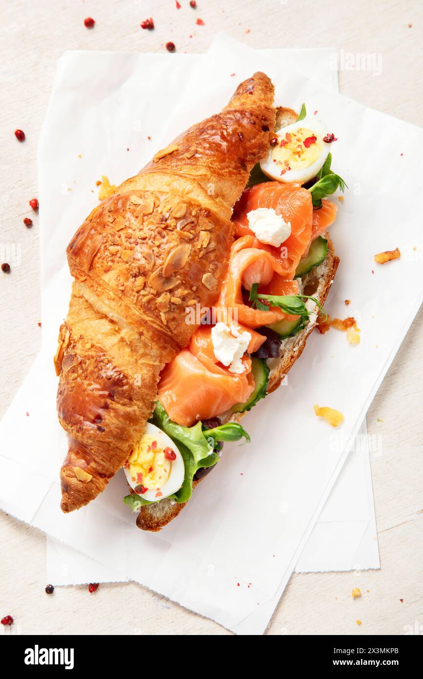 Salted healthy breakfast on light background. Fresh salmon croissant ...