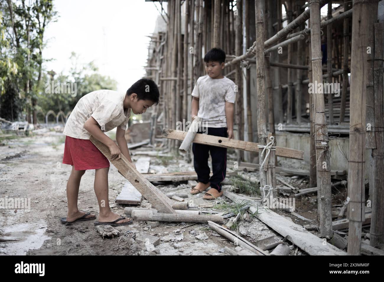 child labor concept. Children working at construction site, Poor ...