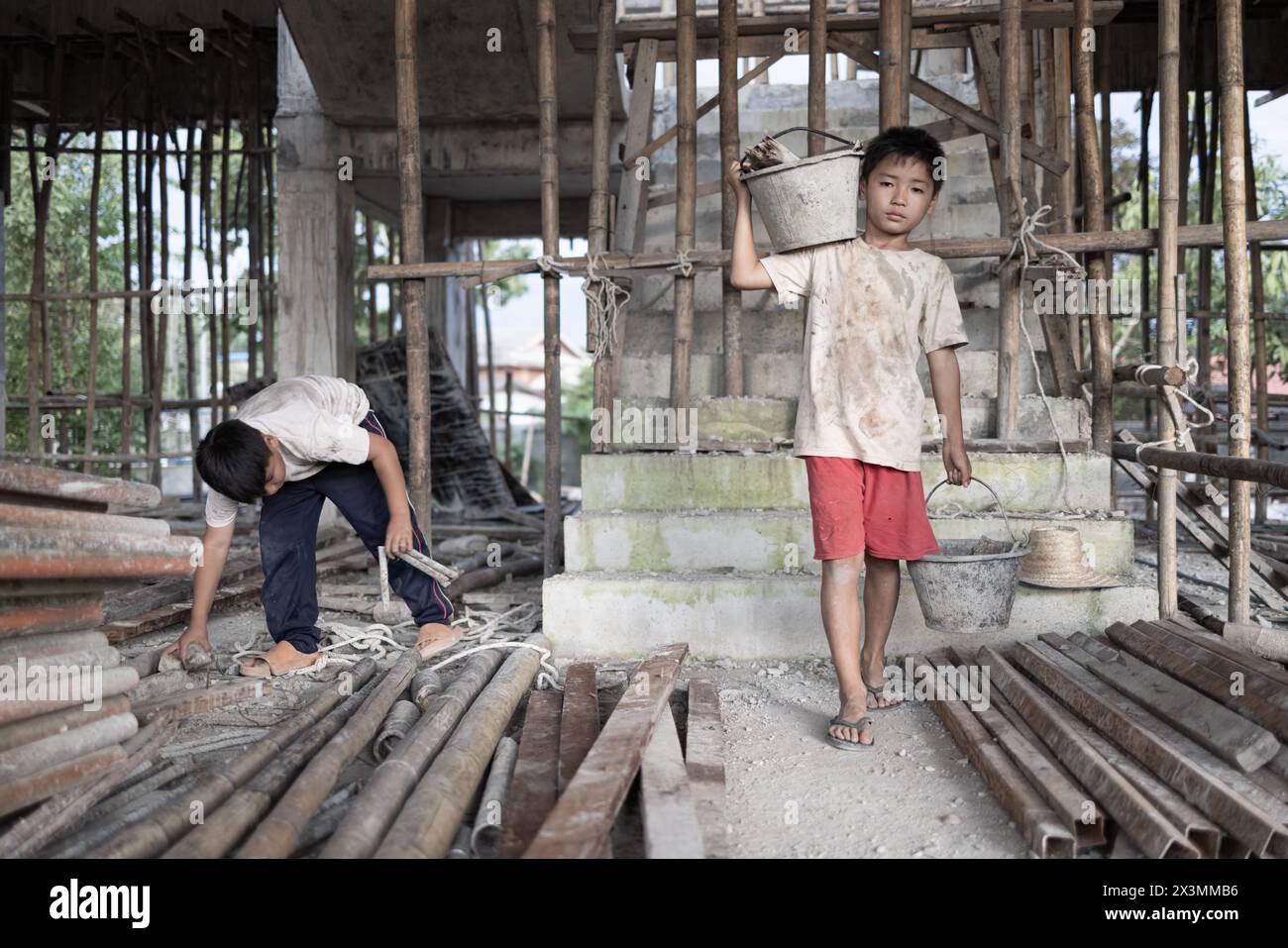 child labor concept. Children working at construction site, Poor ...