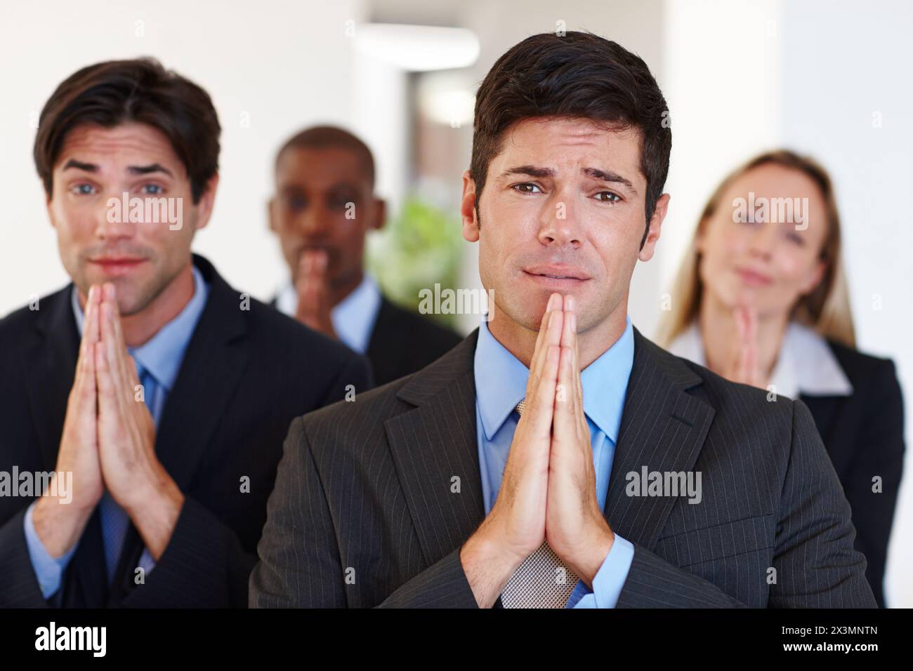 Businessman hands together in prayer hi-res stock photography and ...
