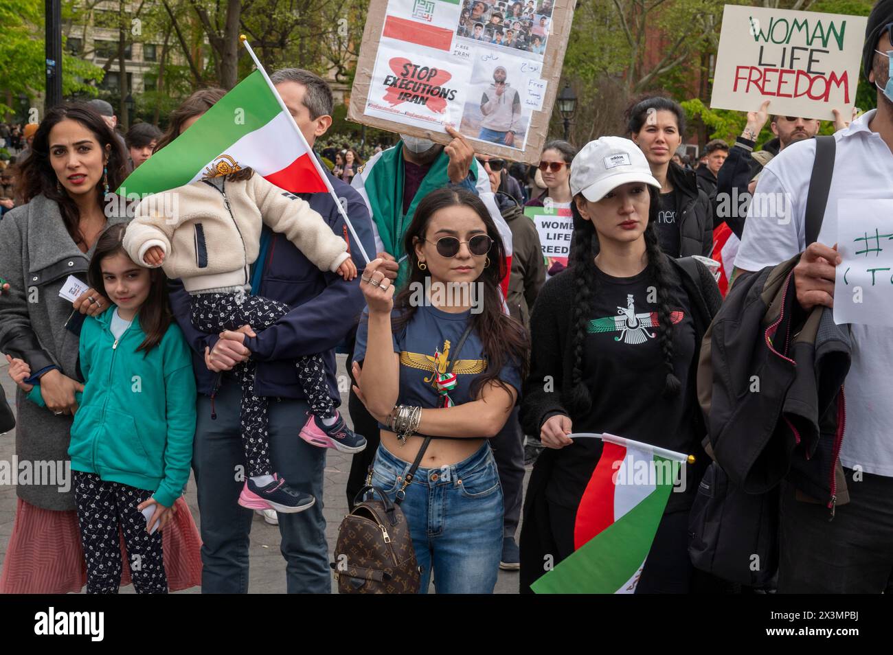New York, United States. 27th Apr, 2024. Protesters hold Iranian flags ...