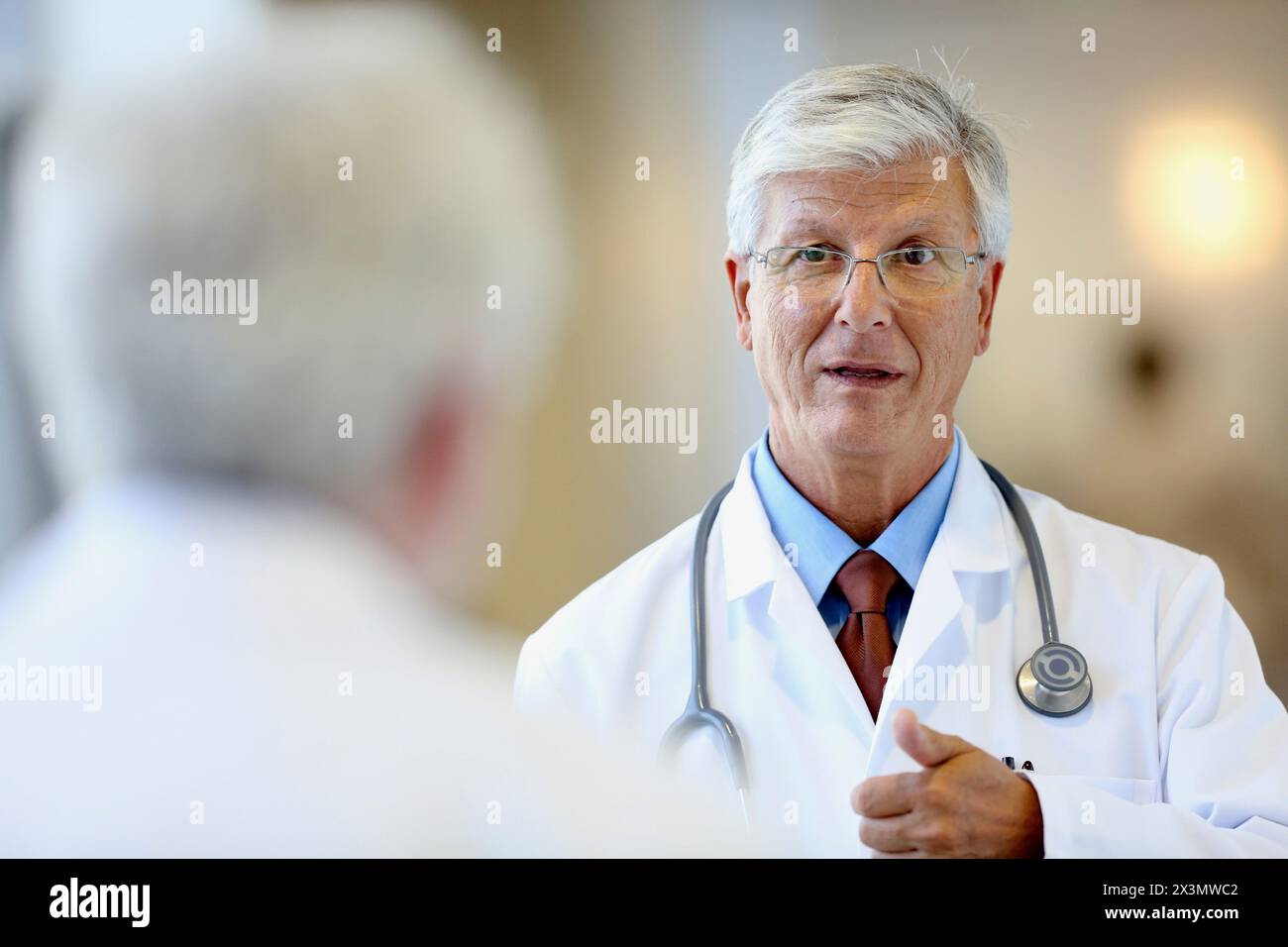 Doctor with stethoscope talking with patient, Onkologikoa Hospital ...