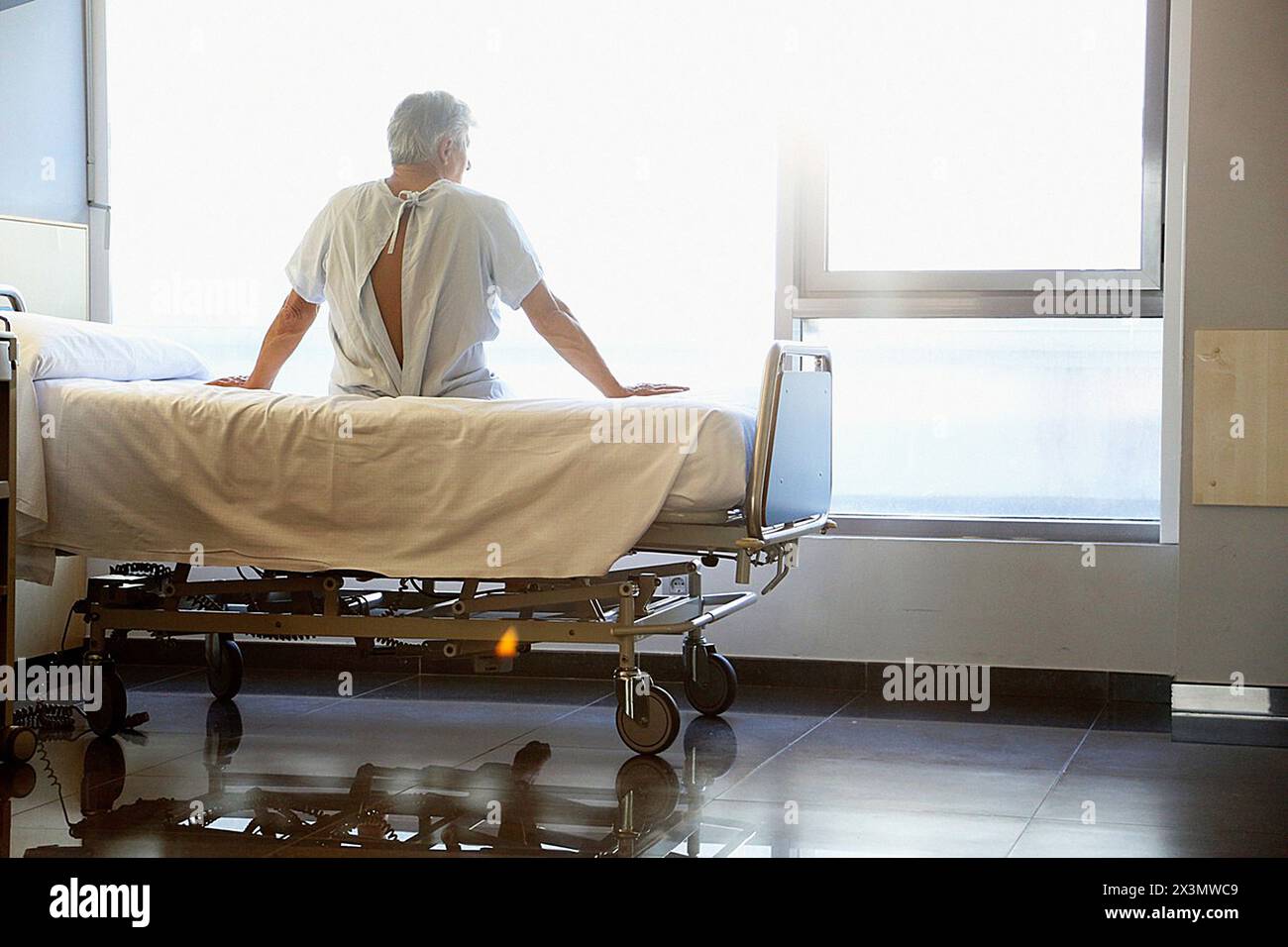 Back view patient man hospital bed hi-res stock photography and images ...