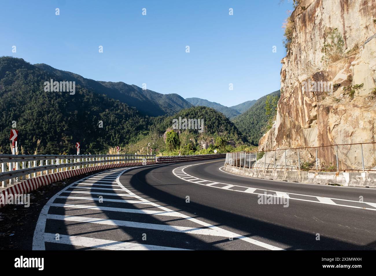 Turning asphalt road with new white marking lines on the highway with ...